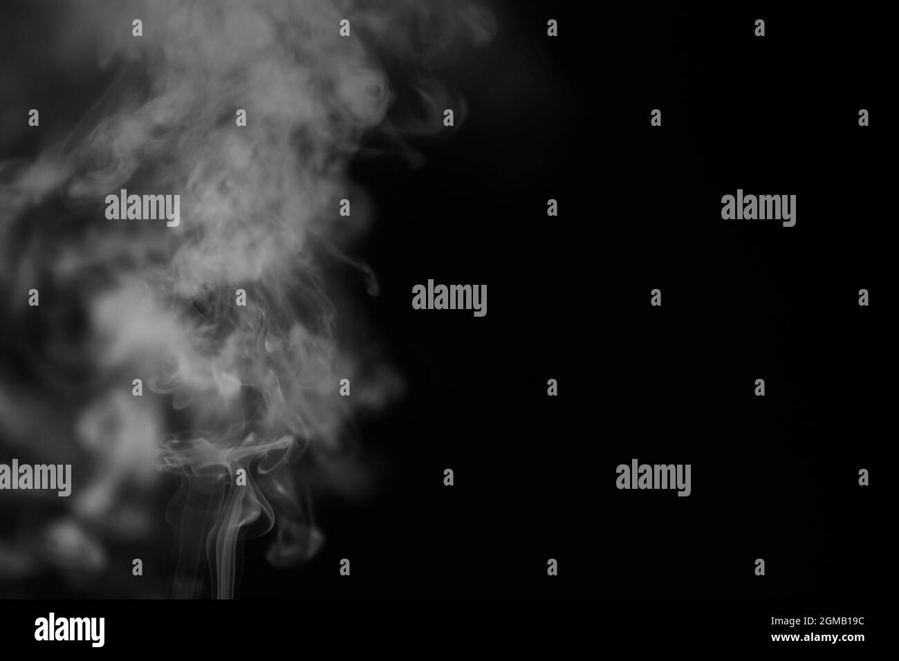 White smoke on a black background. Texture of smoke. Clubs of white ...