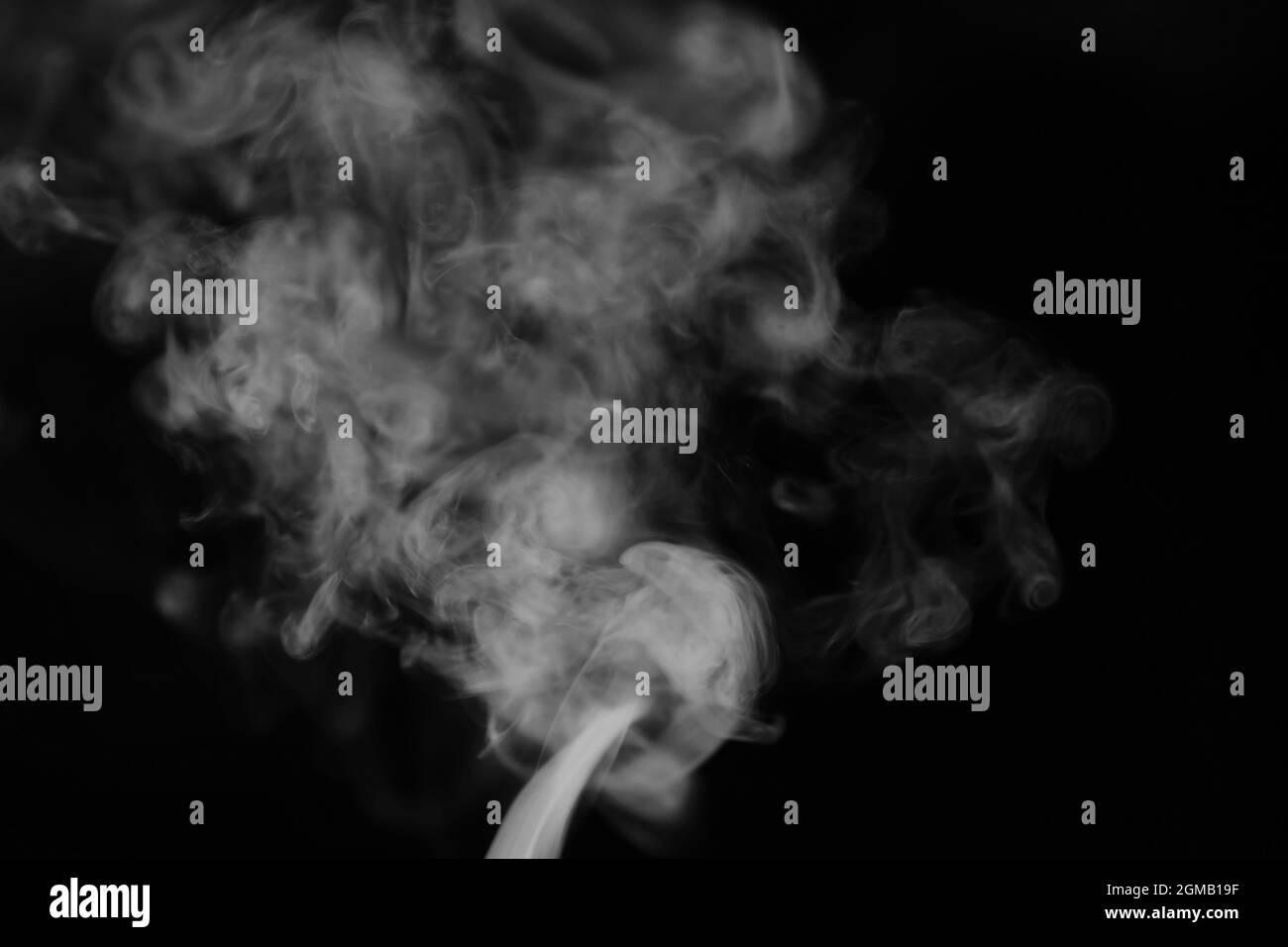 White smoke on a black background. Texture of smoke. Clubs of white ...