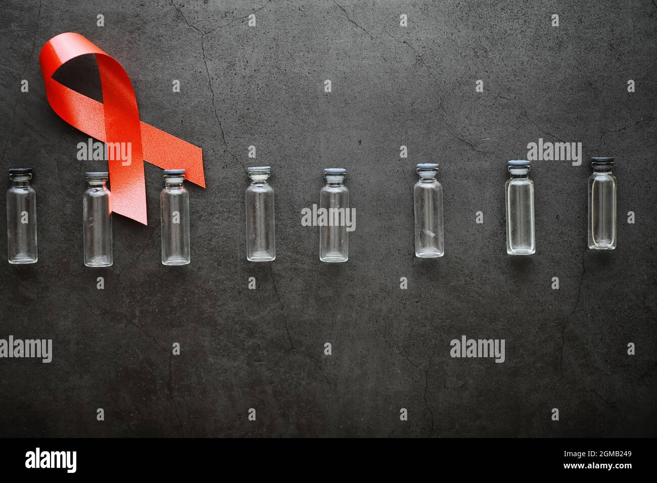 Symbol of human immunodeficiency virus disease. Red ribbon. A helping ...