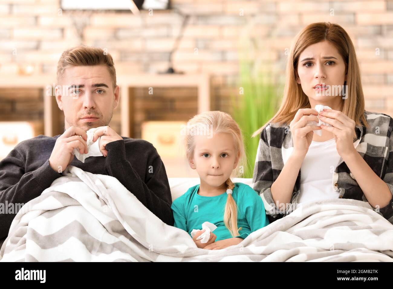 Sick family in bed at home Stock Photo - Alamy