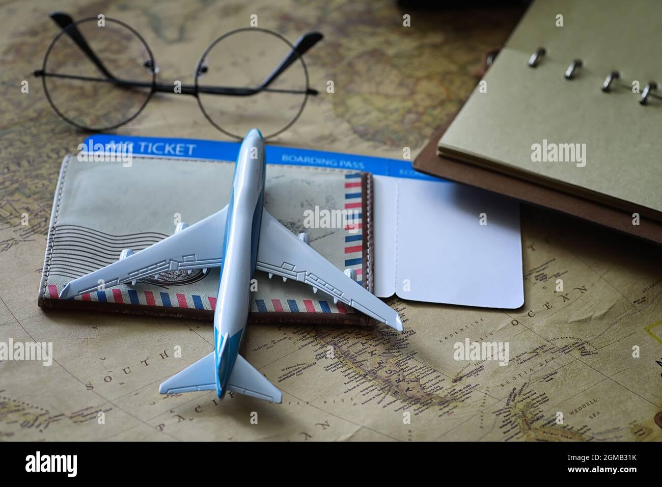 Travel concept. Map on the table and model aircraft Stock Photo - Alamy