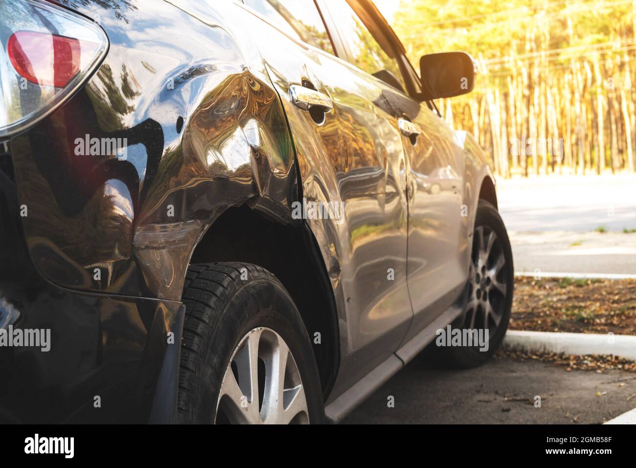 Damaged car after accident on the road. Car crash, wrecked vehicle ...