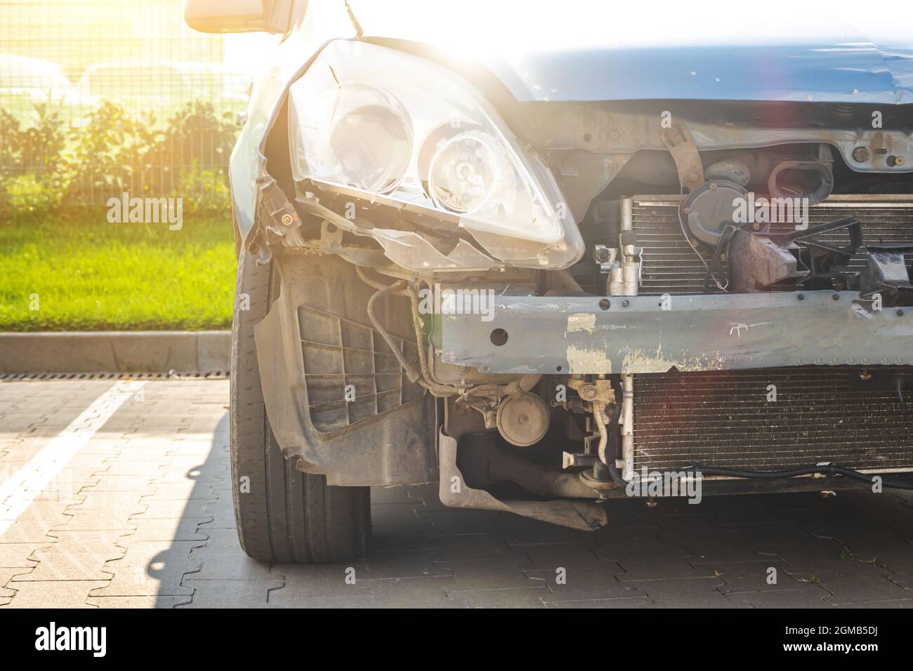 Front side of the wrecked car after accident on the road. Broken ...