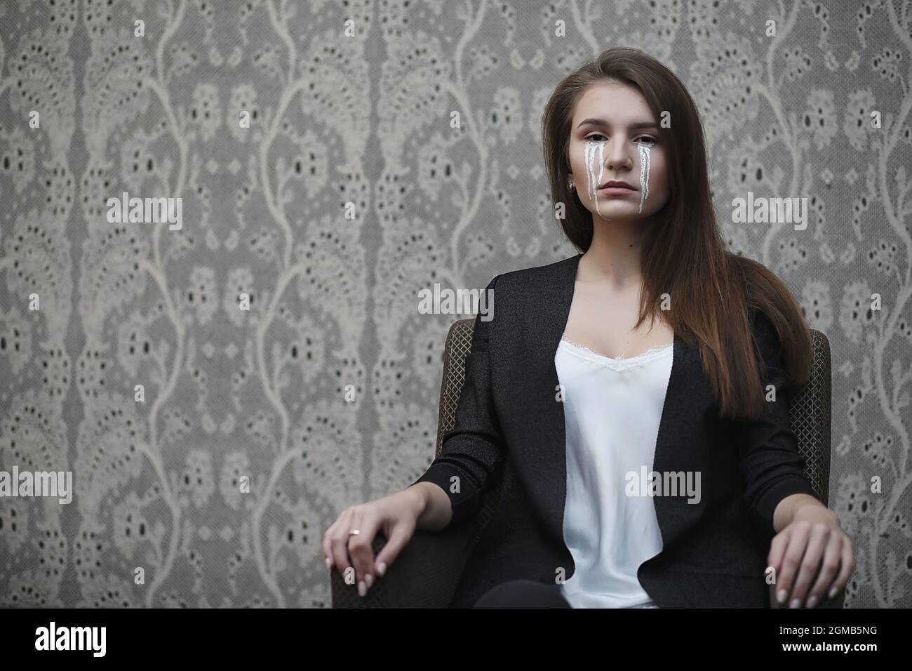 Beautiful girl with tears in eyes. Young girl with painted tears posing ...