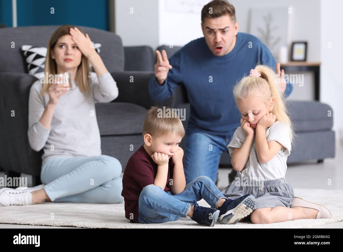 Parents scolding their children at home. Family conflict Stock Photo ...