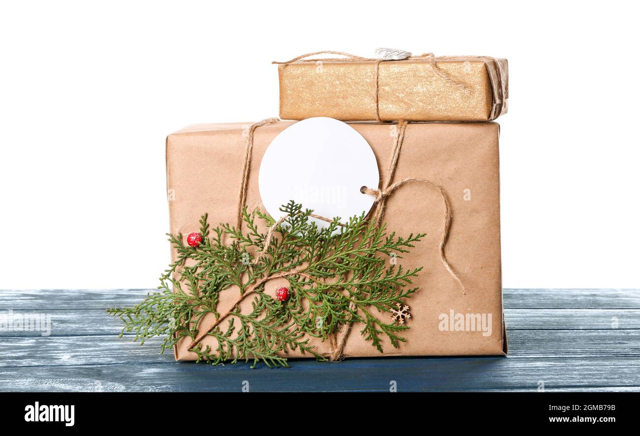 Beautiful Christmas gift boxes on table against white background Stock ...