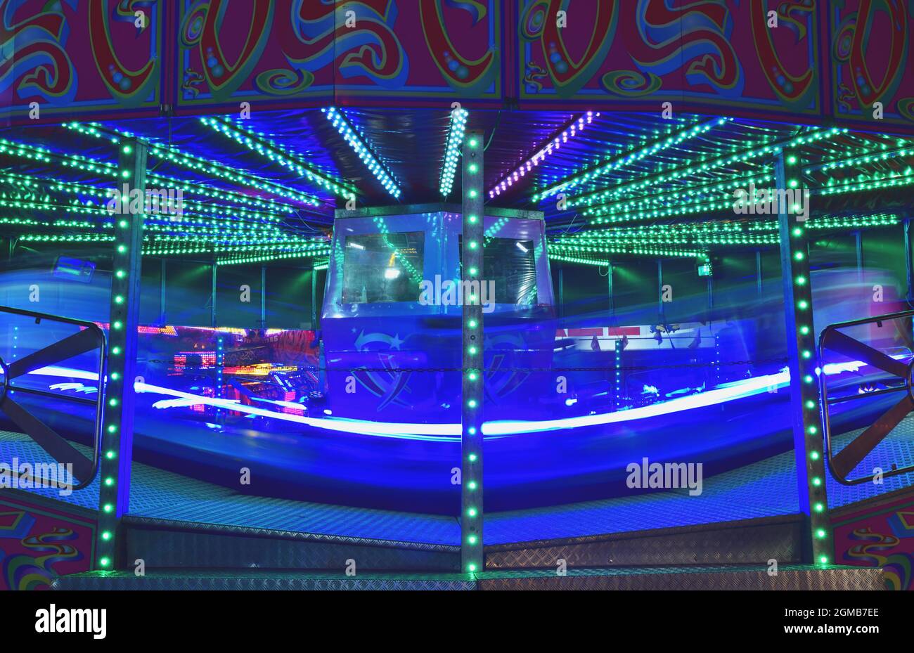 The Waltzer traditional fairground ride at night Stock Photo - Alamy
