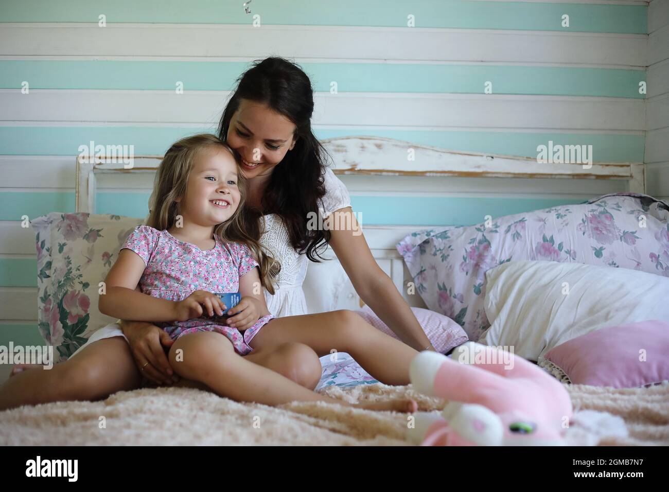 Morning idleness. Mom and daughter have fun Stock Photo - Alamy
