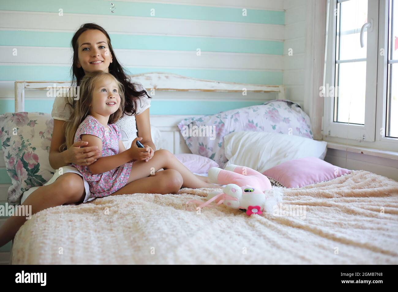 Morning idleness. Mom and daughter have fun Stock Photo - Alamy
