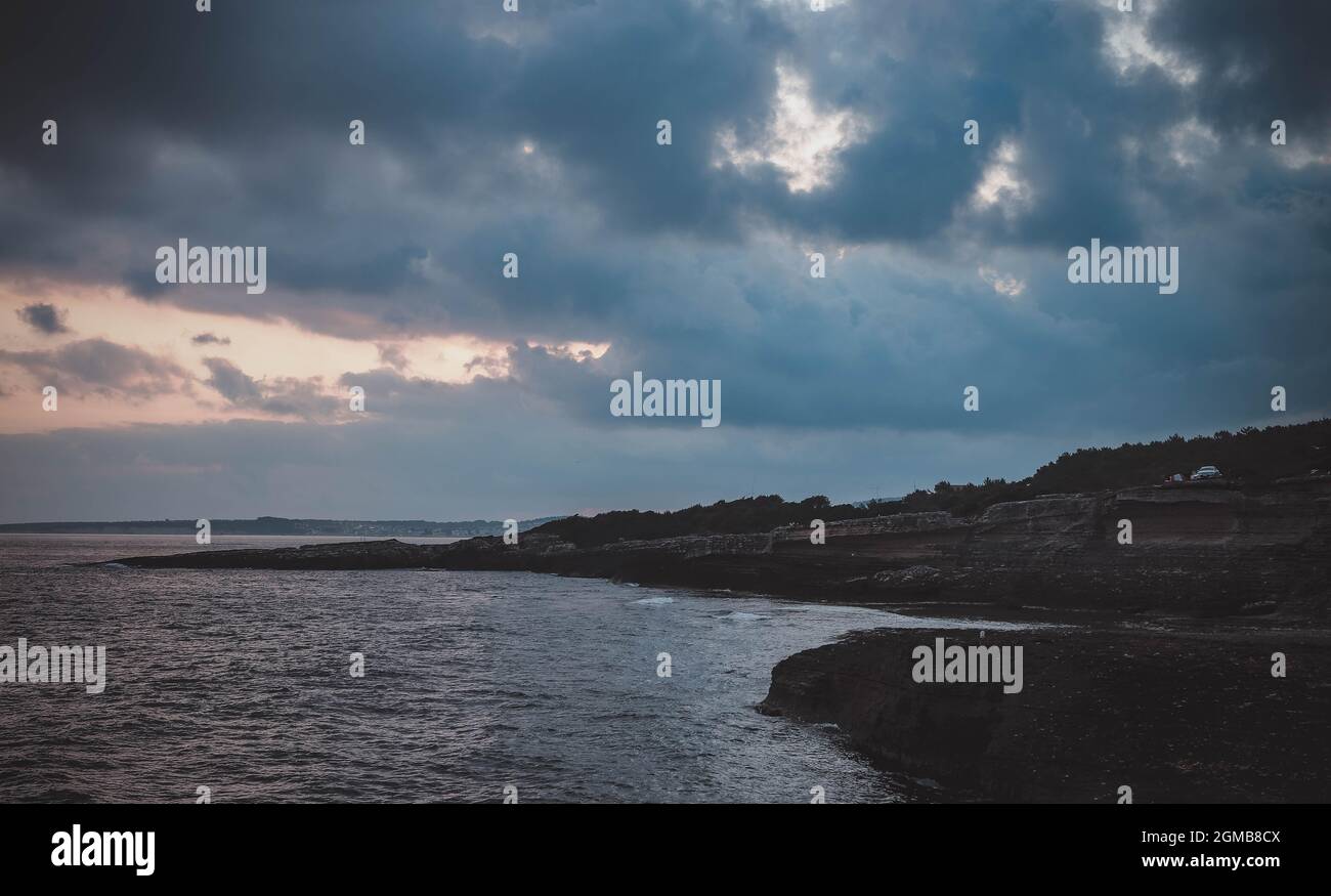 Colorful rocky coastline Stock Photo - Alamy