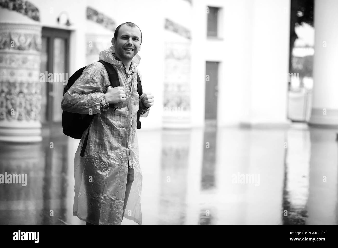 A man in a raincoat on a rainy day in the city Stock Photo - Alamy