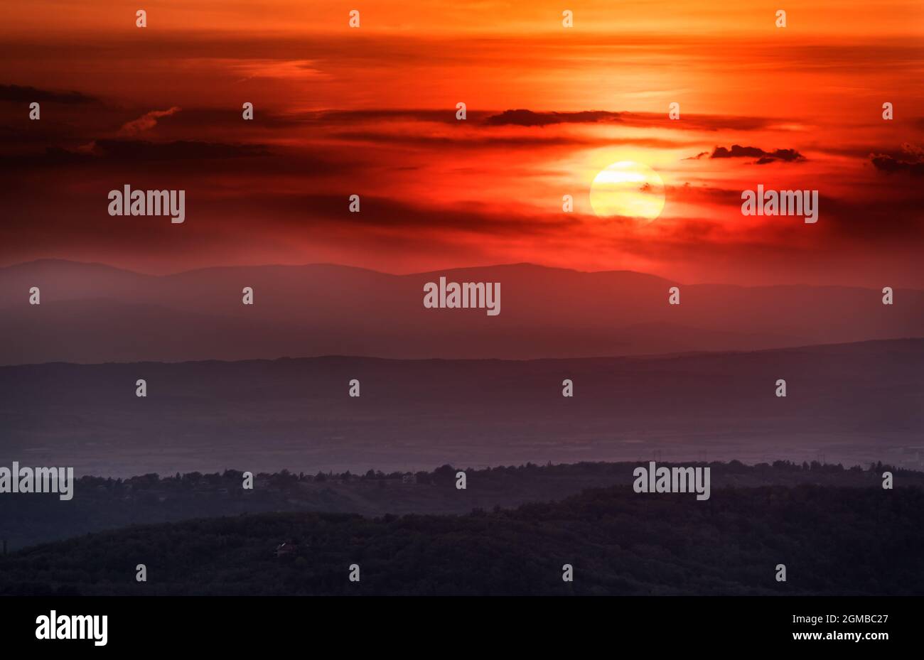 Sunset with layers of hills and mountains, soft focus. Mountain layers ...