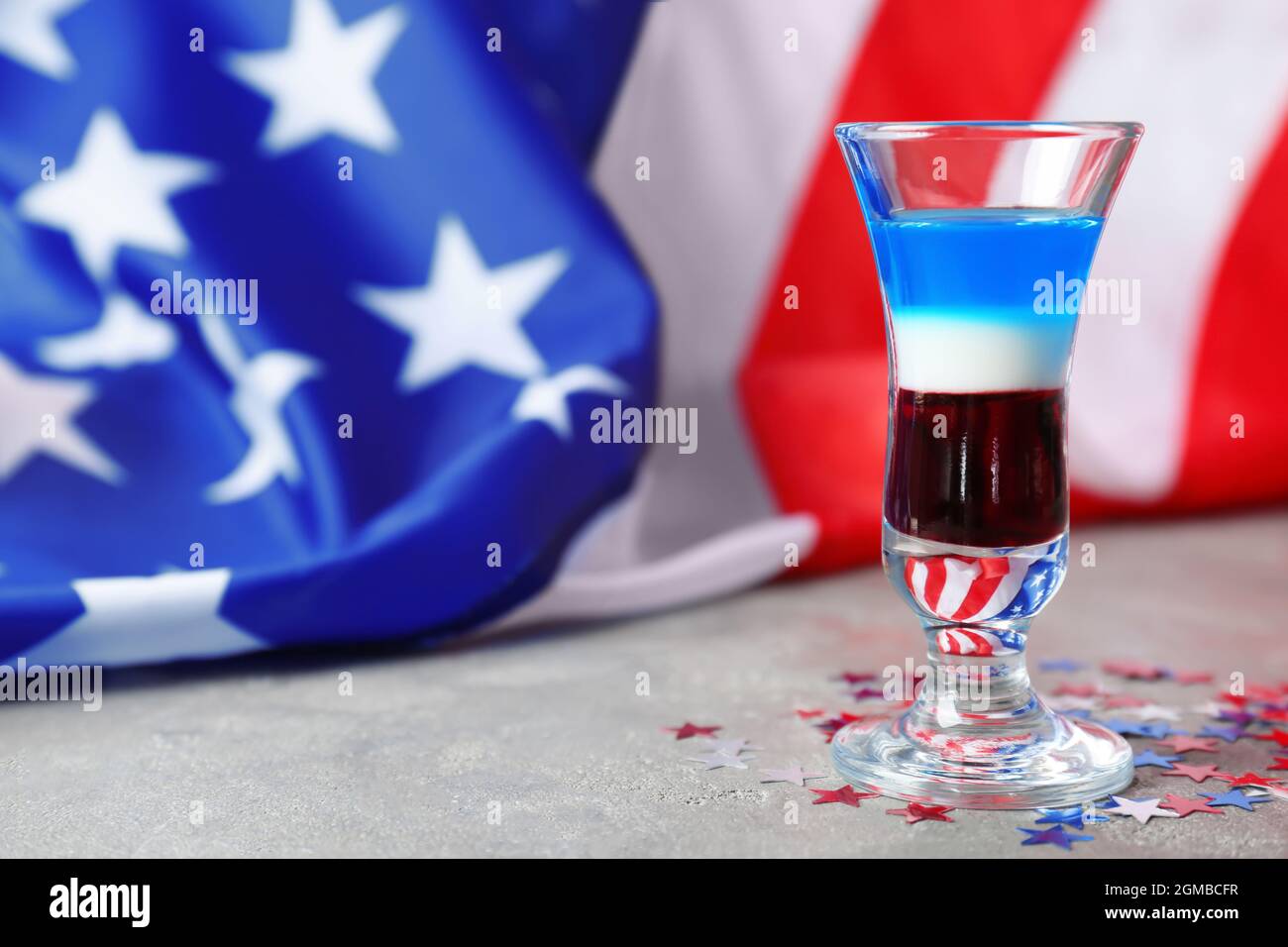 Layered cocktail in colors of American flag on table Stock Photo - Alamy