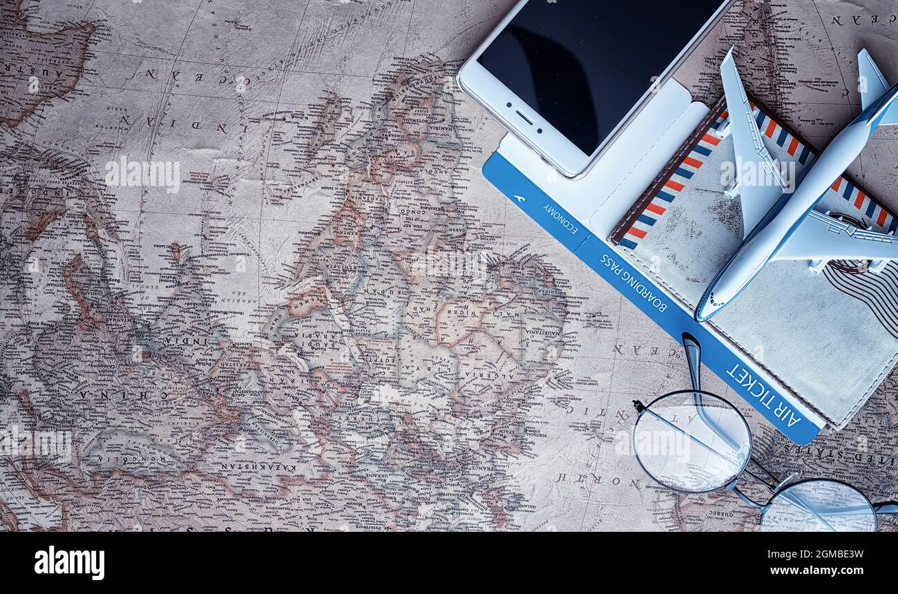 Travel concept. Map on the table and model aircraft Stock Photo - Alamy