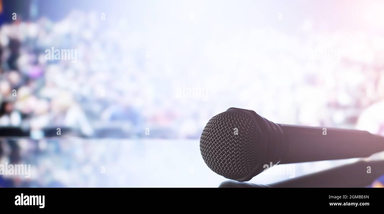 The microphone on the stage in front of the hall. Performance on stage ...