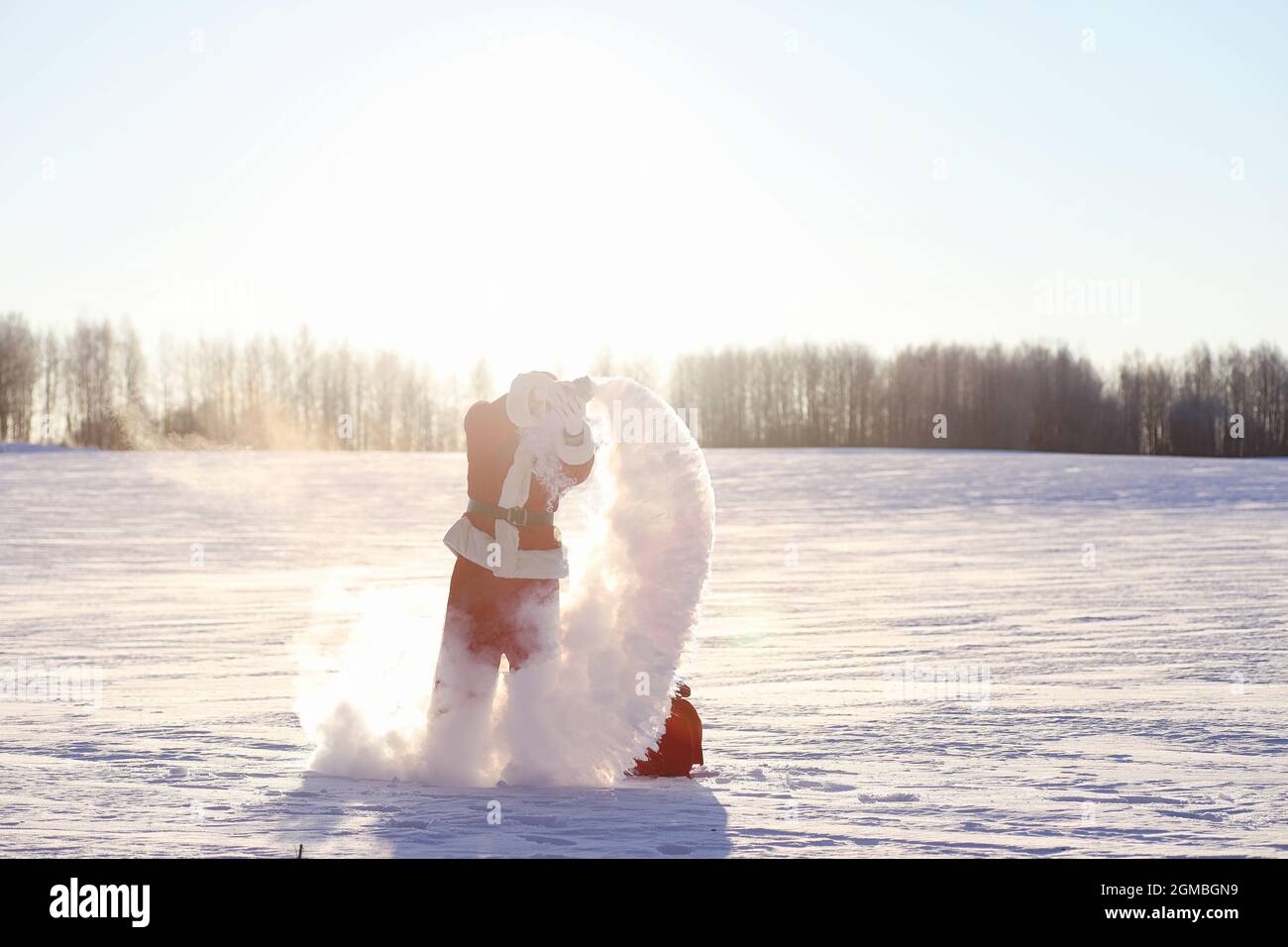 Santa in the winter field. Santa magical fog walking along the field ...