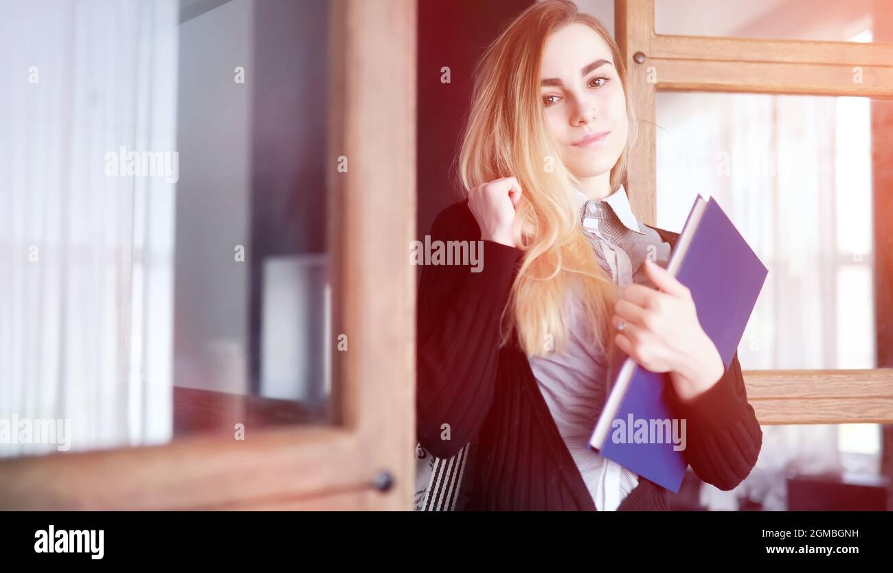 Young pretty blonde girl student before class Stock Photo - Alamy