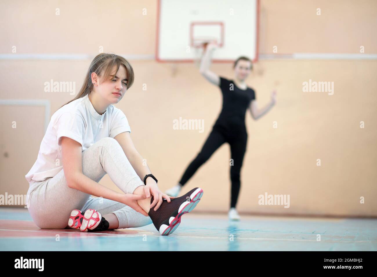 Girl young student in the gym playing a basketball Stock Photo - Alamy