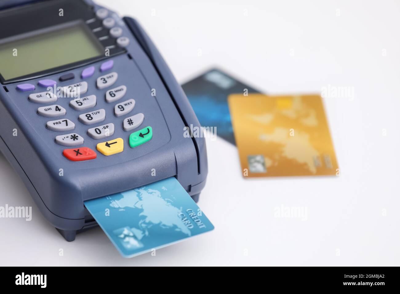 Credit card and bank terminal on white background Stock Photo - Alamy