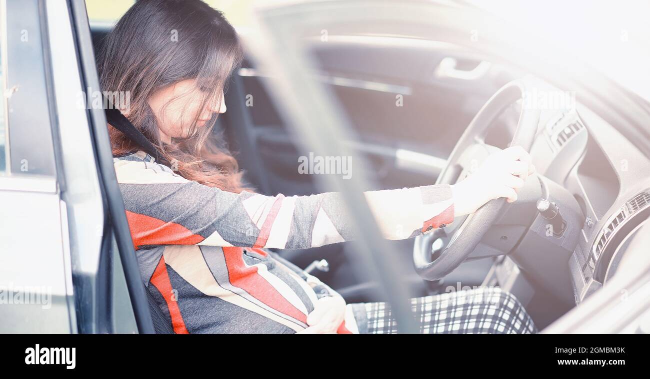Girl driving a car bad emotions on her face Stock Photo - Alamy