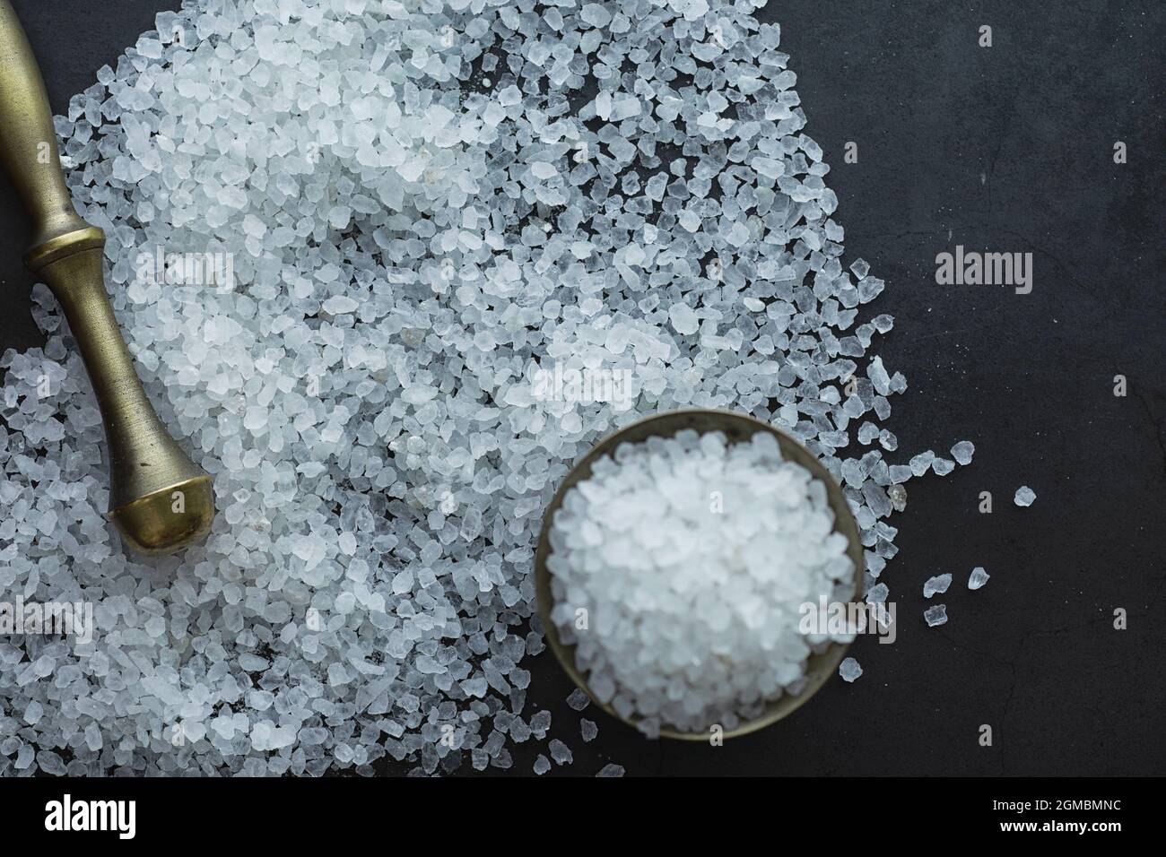Large sea salt. Spice. Mortar and pestle for grinding salt Stock Photo ...