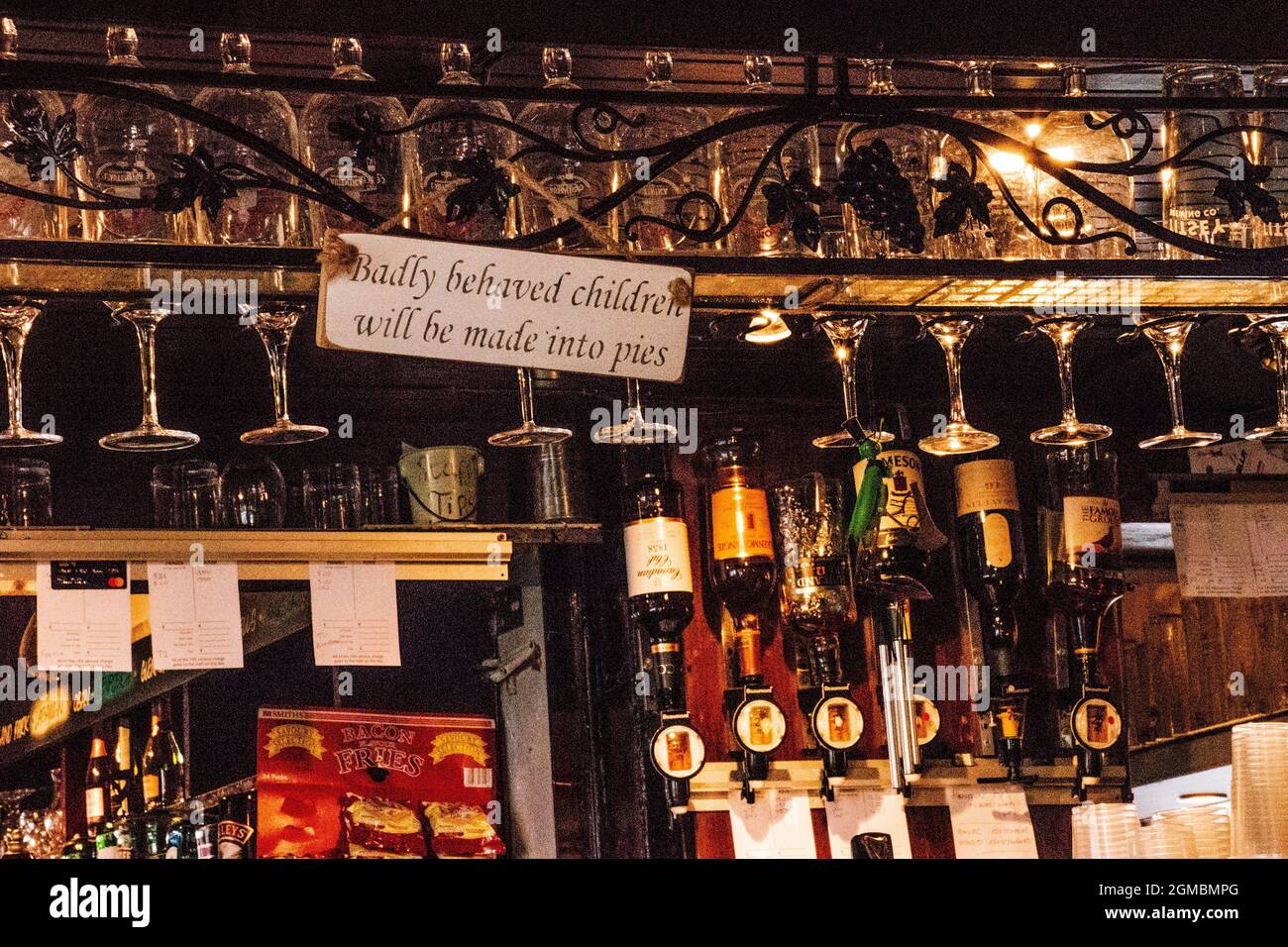 An amusing 'Child warning sign' above a bar Stock Photo - Alamy