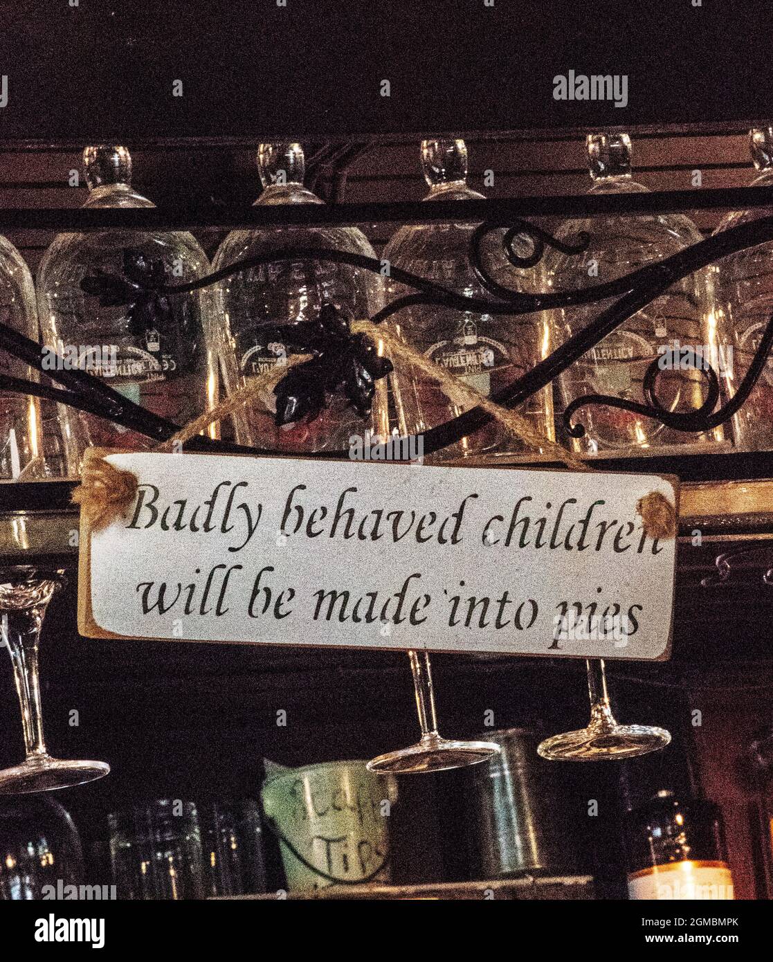 An amusing 'Child warning sign' above a bar Stock Photo - Alamy