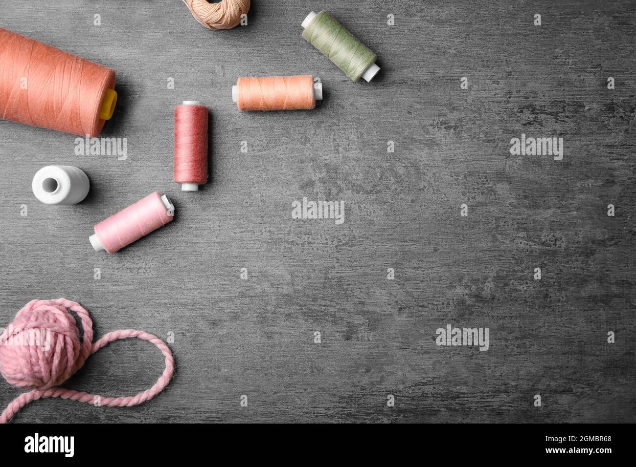 Different types of threads on grey background, top view Stock Photo - Alamy