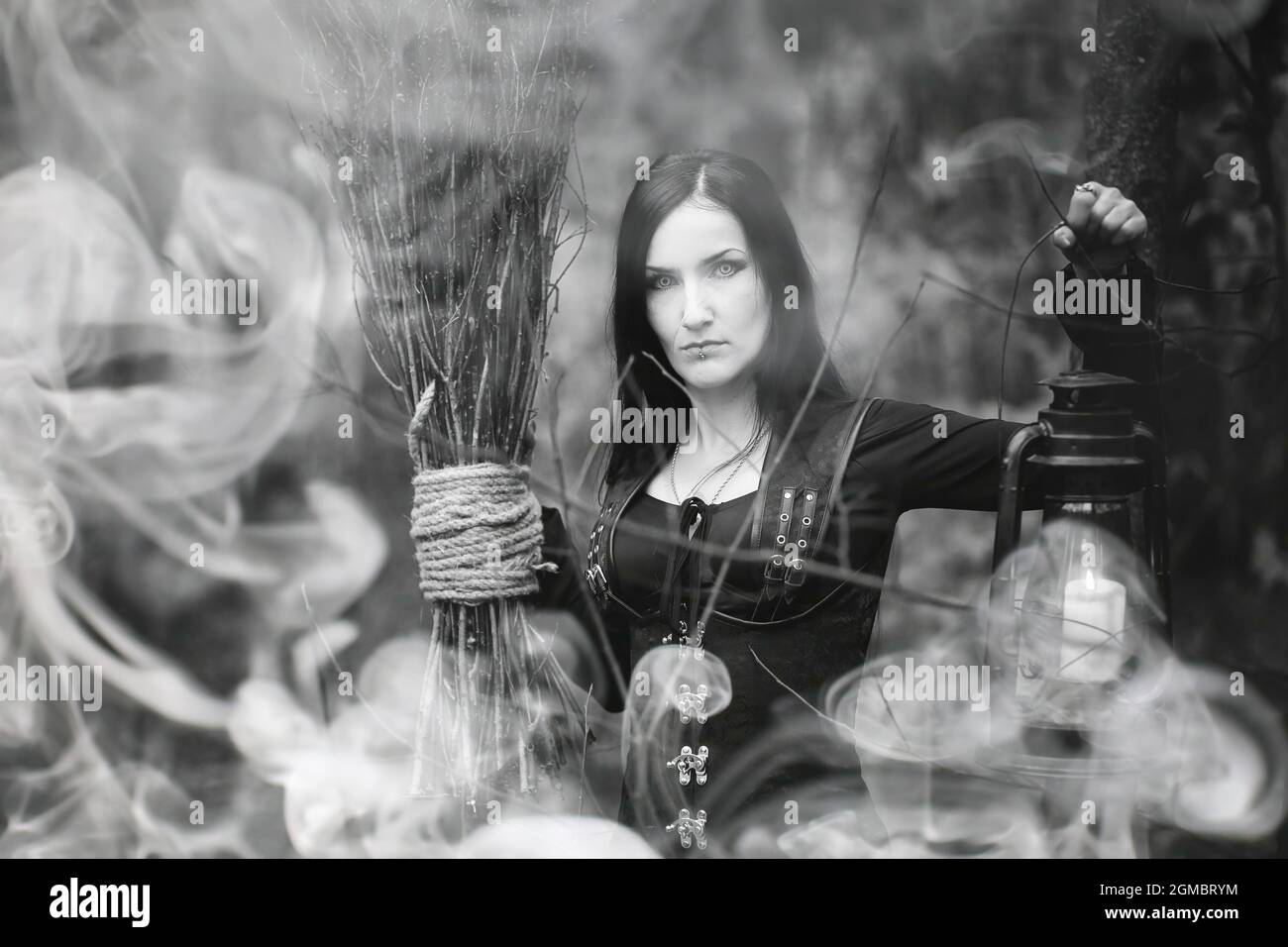 A woman in a witch suit in a dense forest on a ritual Stock Photo - Alamy