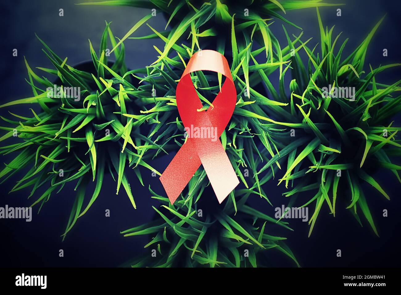 Symbol of human immunodeficiency virus disease. Red ribbon. A helping ...