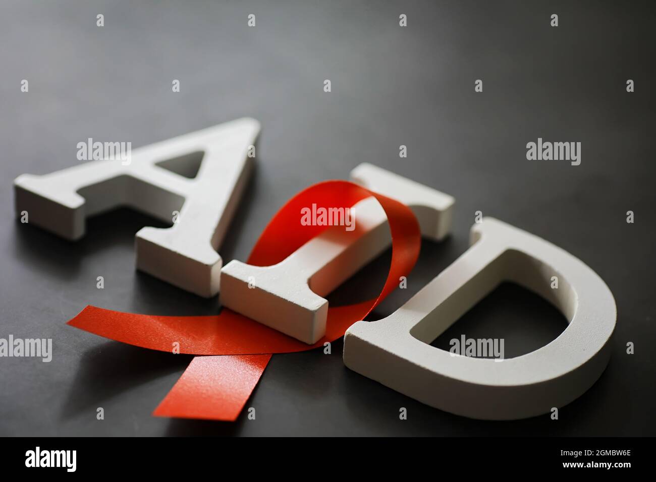 Symbol of human immunodeficiency virus disease. Red ribbon. A helping ...