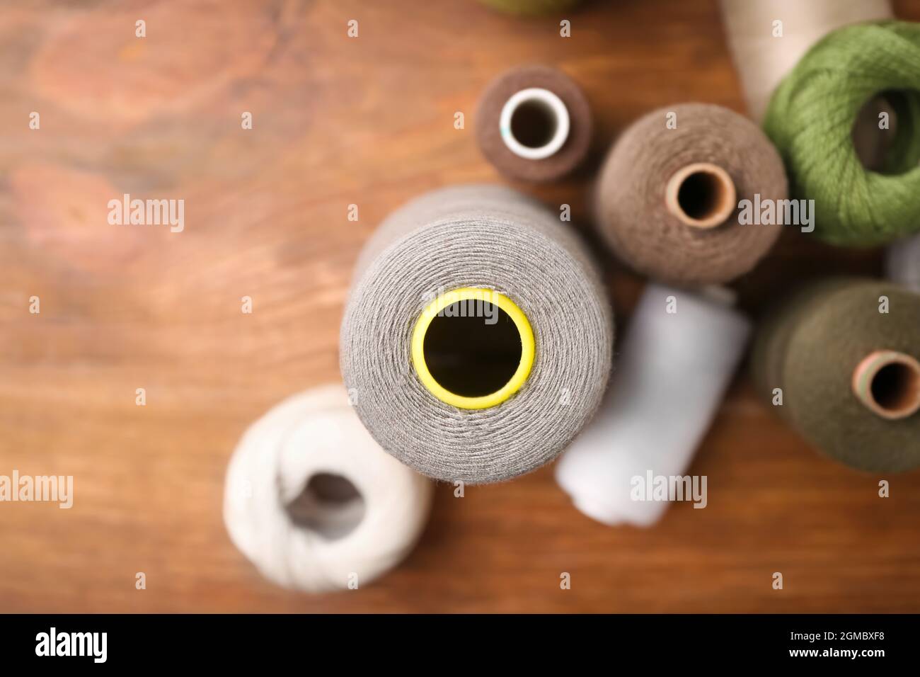 Set of color sewing threads on table, top view Stock Photo - Alamy
