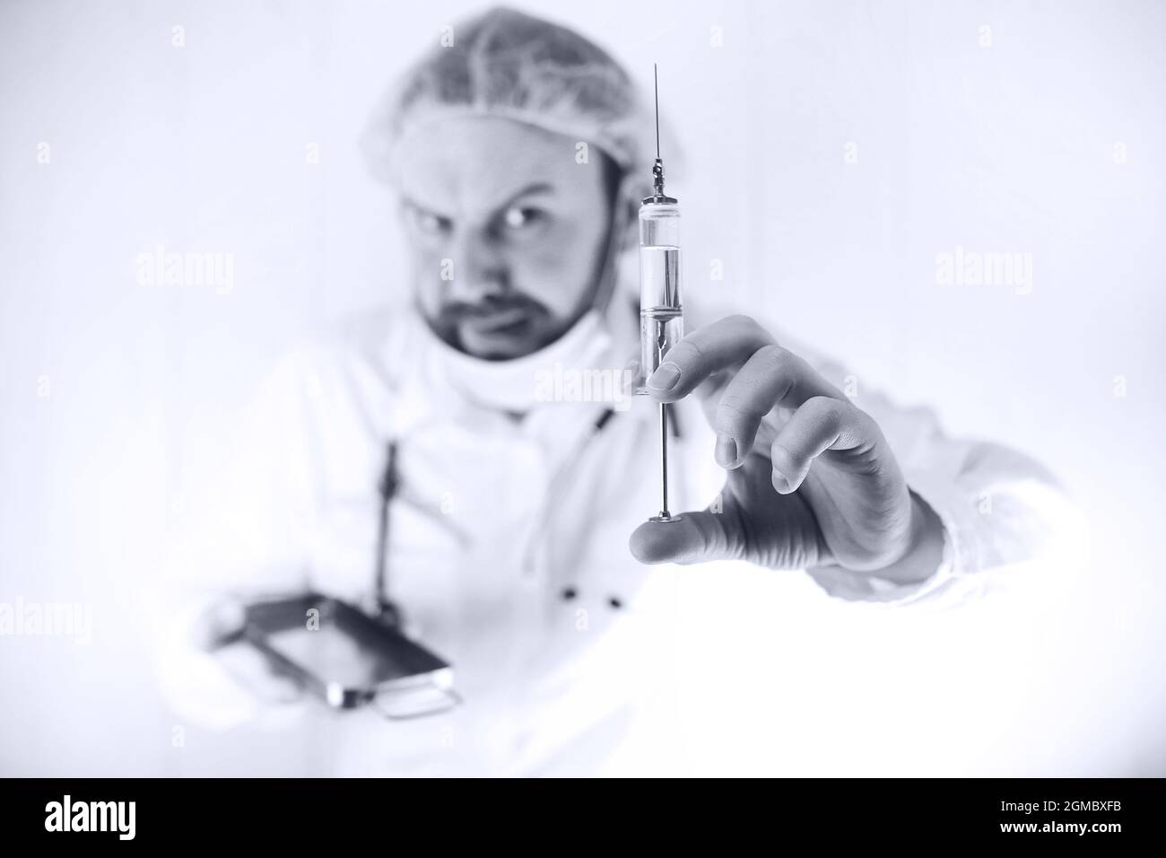Black and white photo of bearded doctor in a white coat and an old ...