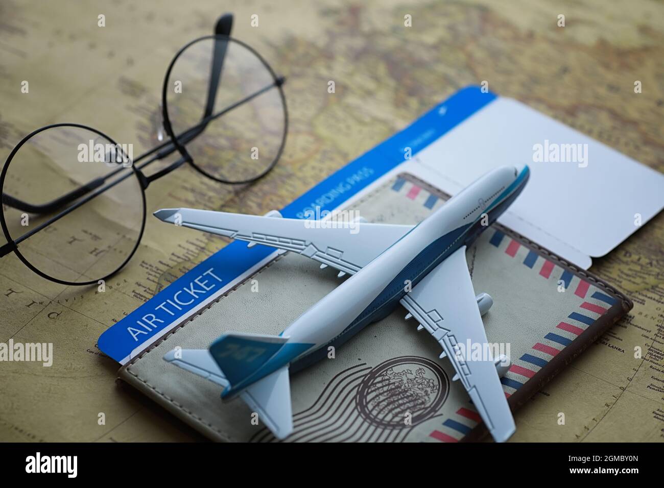 Travel concept. Map on the table and model aircraft Stock Photo - Alamy