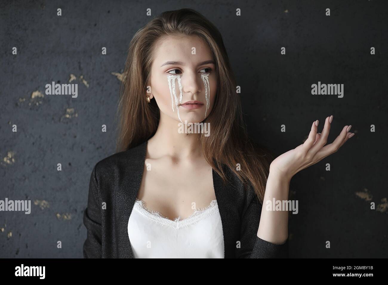Beautiful girl with tears in eyes. Young girl with painted tears posing ...