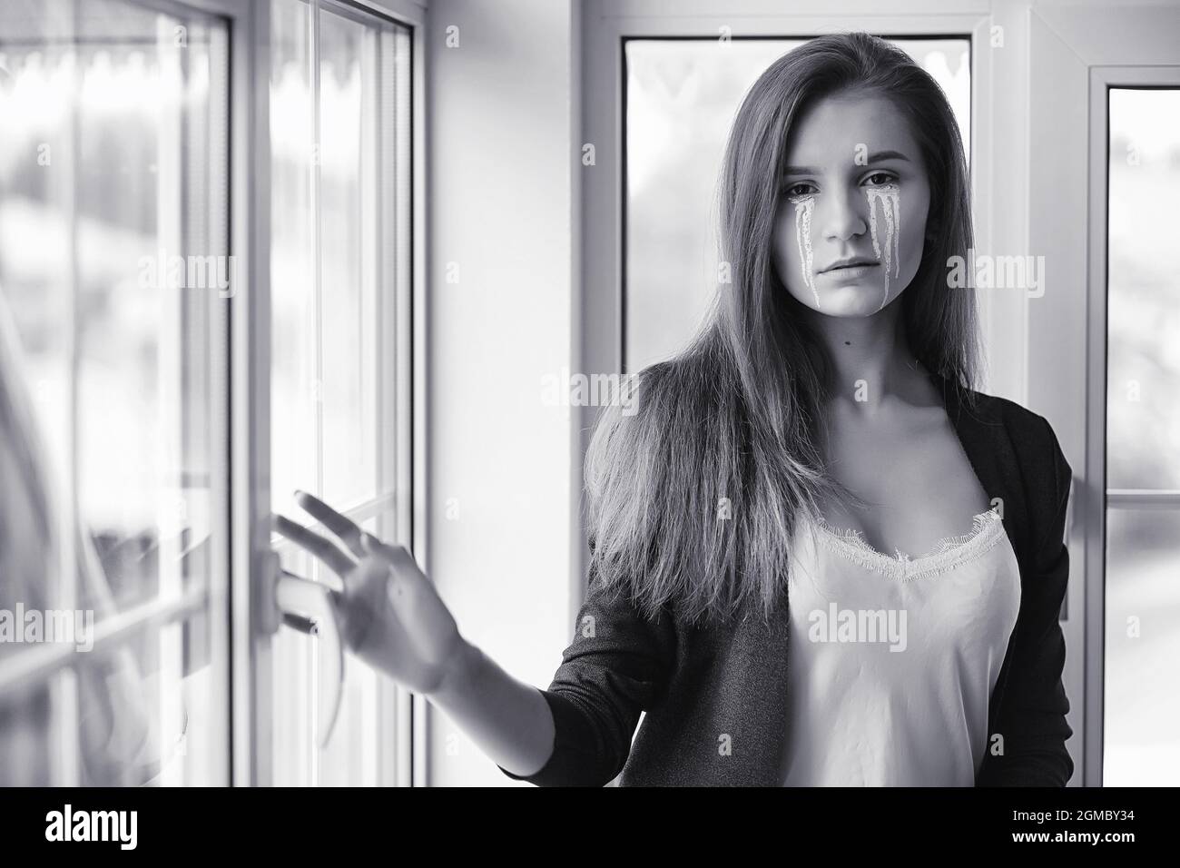 Beautiful girl with tears in eyes. Young girl with painted tears posing ...