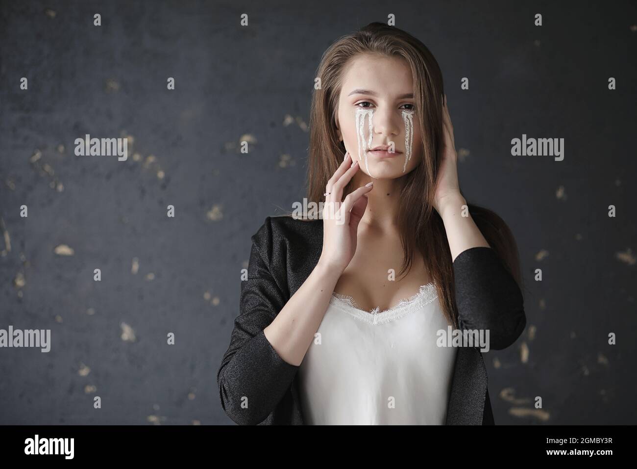 Beautiful girl with tears in eyes. Young girl with painted tears posing ...