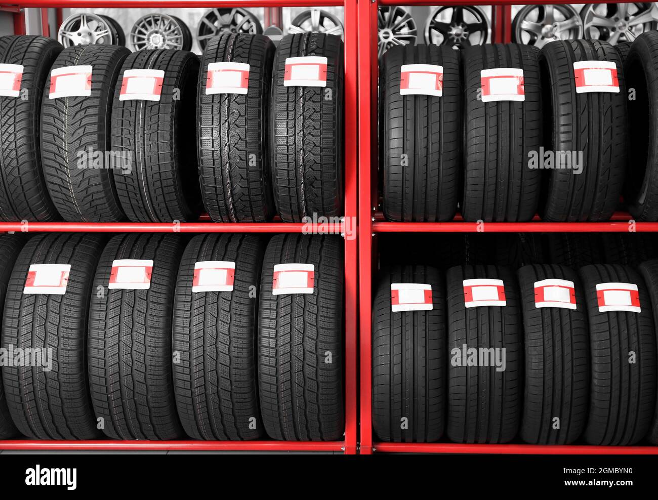 Stand with car tires in automobile store Stock Photo - Alamy