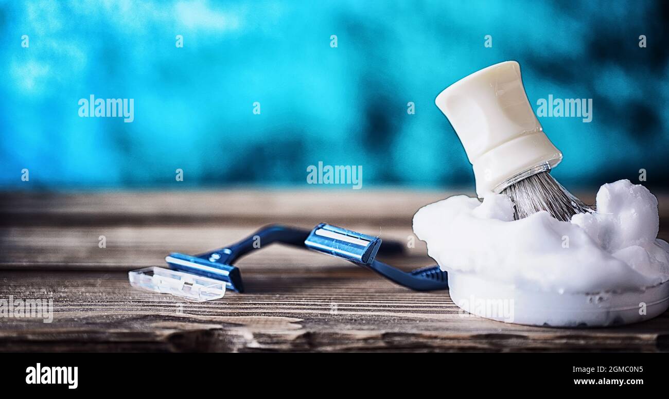 Shaving accessories on a wooden texture background. Tools. Disposable ...