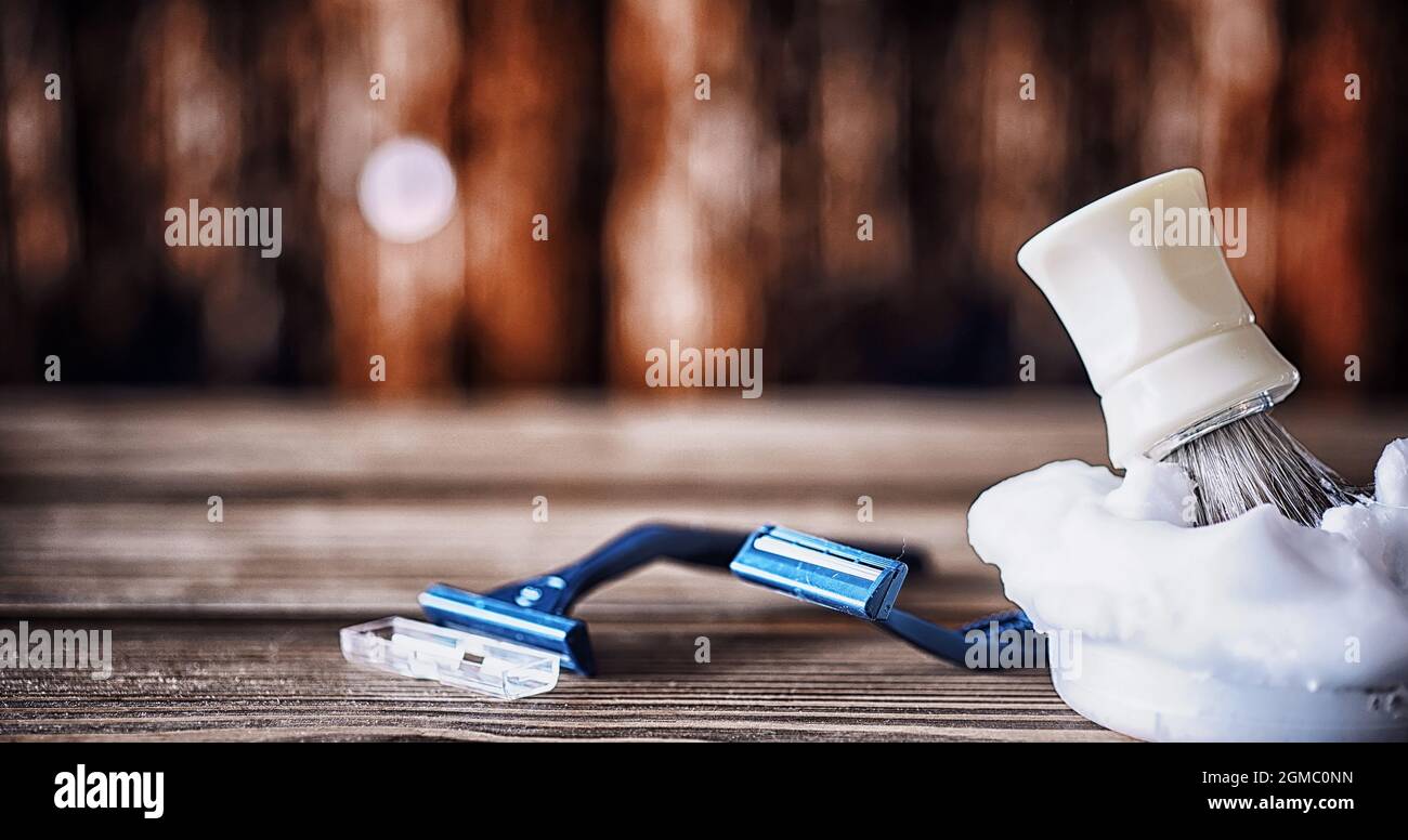 Shaving accessories on a wooden texture background. Tools. Disposable ...