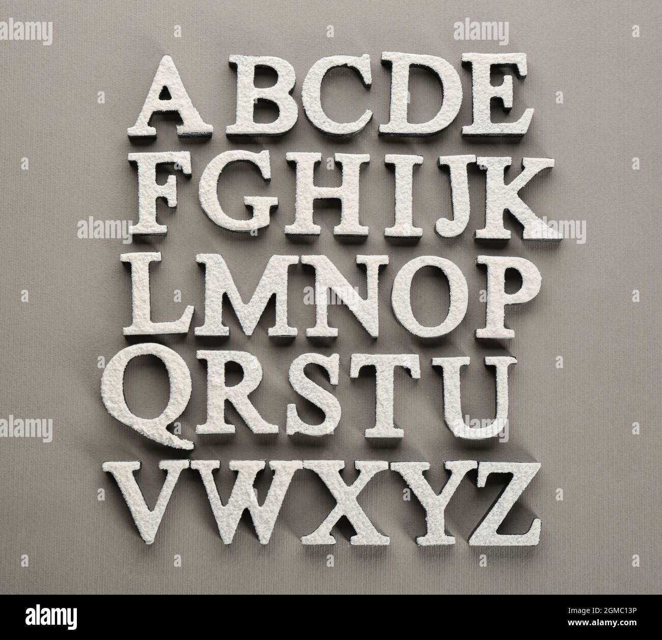 Floured alphabet letters on light background Stock Photo - Alamy