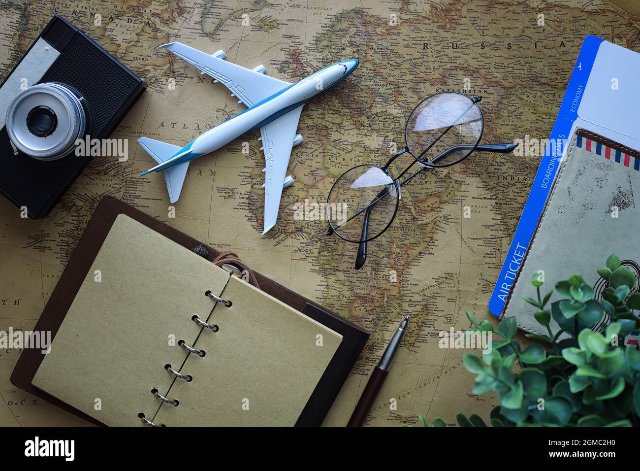 Travel concept. Map on the table and model aircraft Stock Photo - Alamy