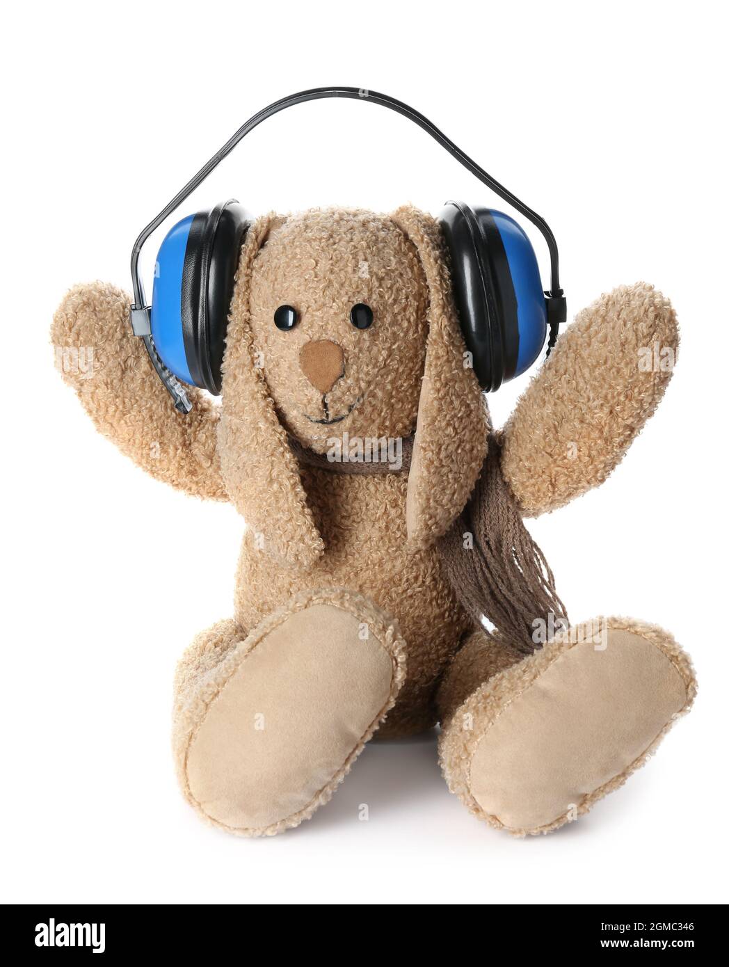 Toy bunny with headphones on white background. Hearing protection Stock ...