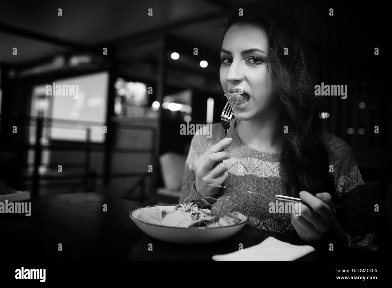 Beautiful girl in a cafe having a cup of coffee at a dinner Stock Photo ...