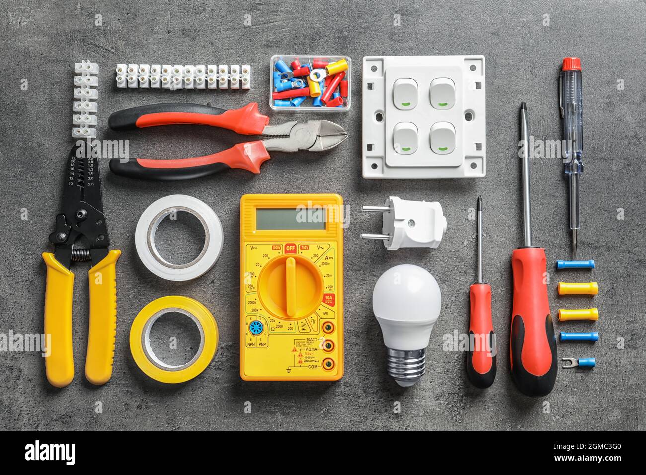 Different electrical tools on grey background Stock Photo - Alamy