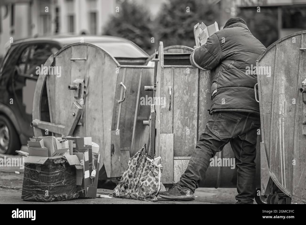 Poor rummaging in the garbage hi-res stock photography and images - Alamy