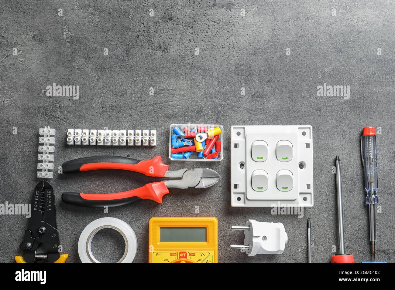 Different electrical tools on grey background Stock Photo - Alamy