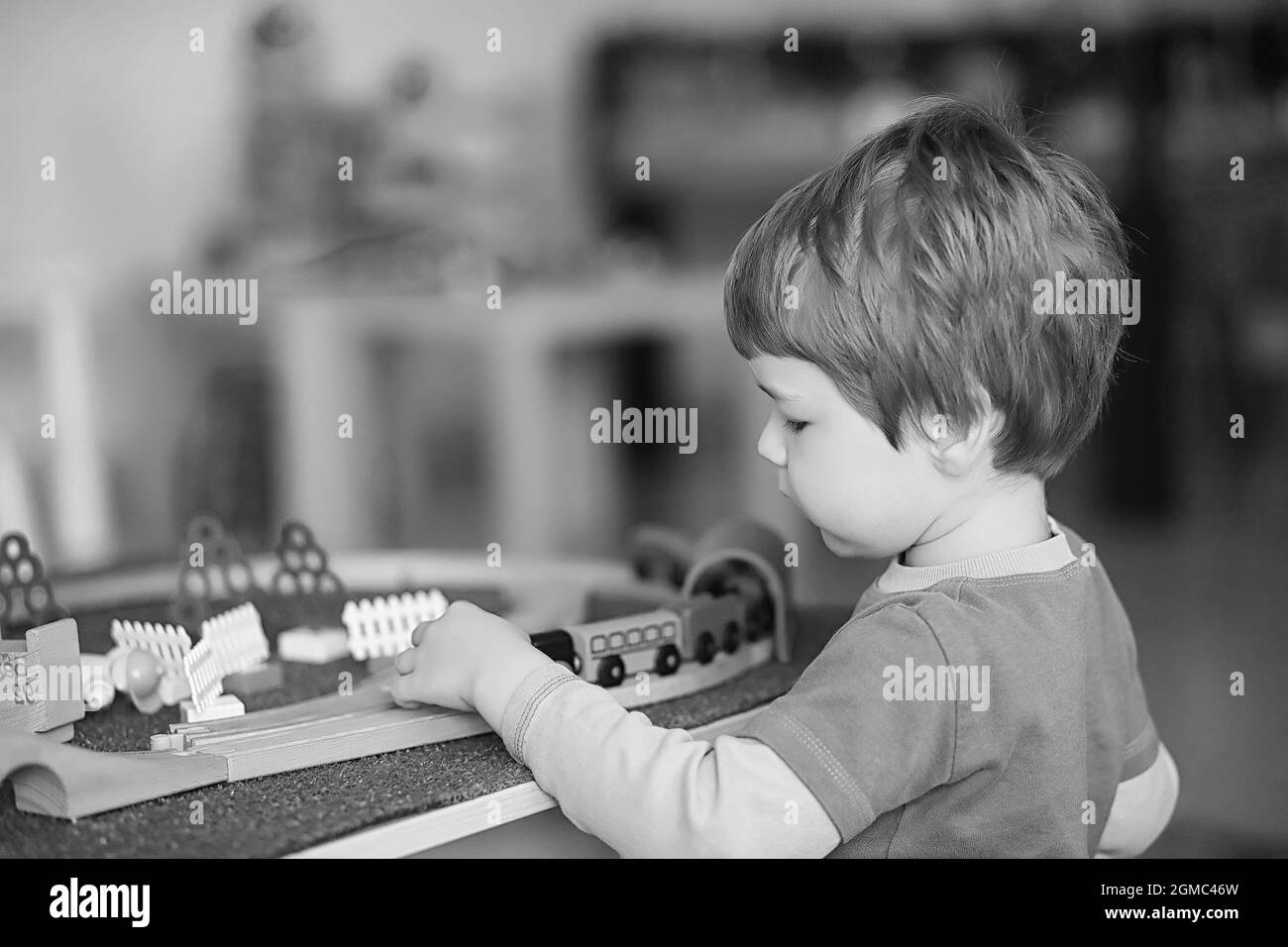 Child in the children's room. The kid is sitting on the windowsill at ...