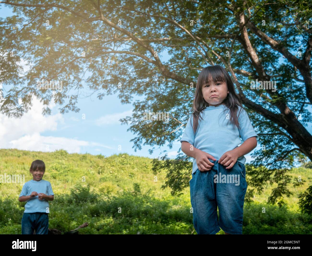 The conflict of the sisters during plays in the garden. Sibling ...