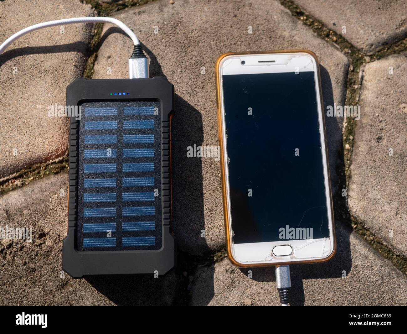 Rechargeable mobile power pack with solar panels, close-up. Connected ...
